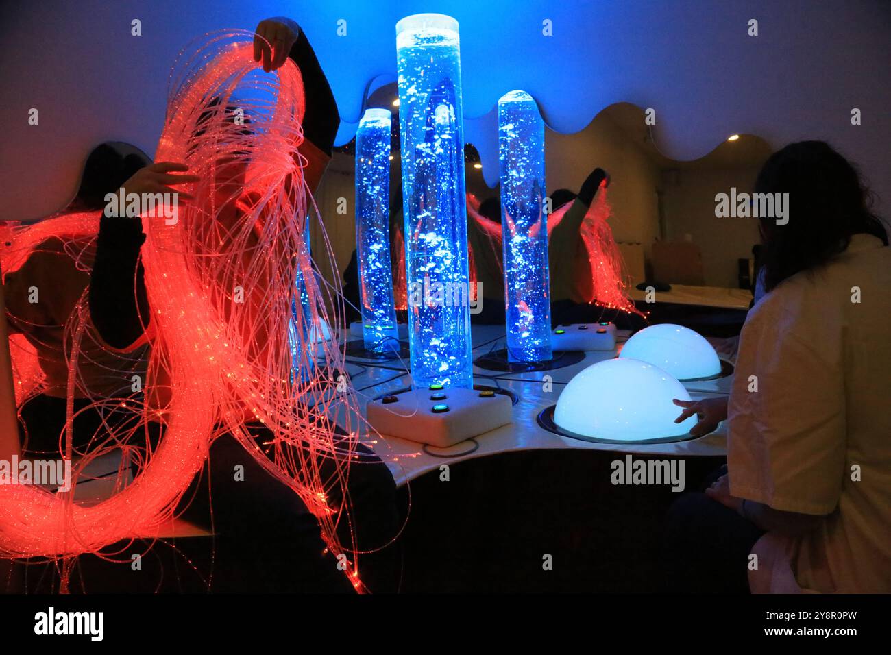 Snoezelen space with a patient and a nurse in a mental health facility ...