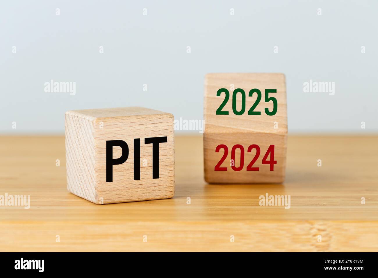 Income tax settlement Pit. Year 2024/2025 Symbol. Wooden cubes with the ...