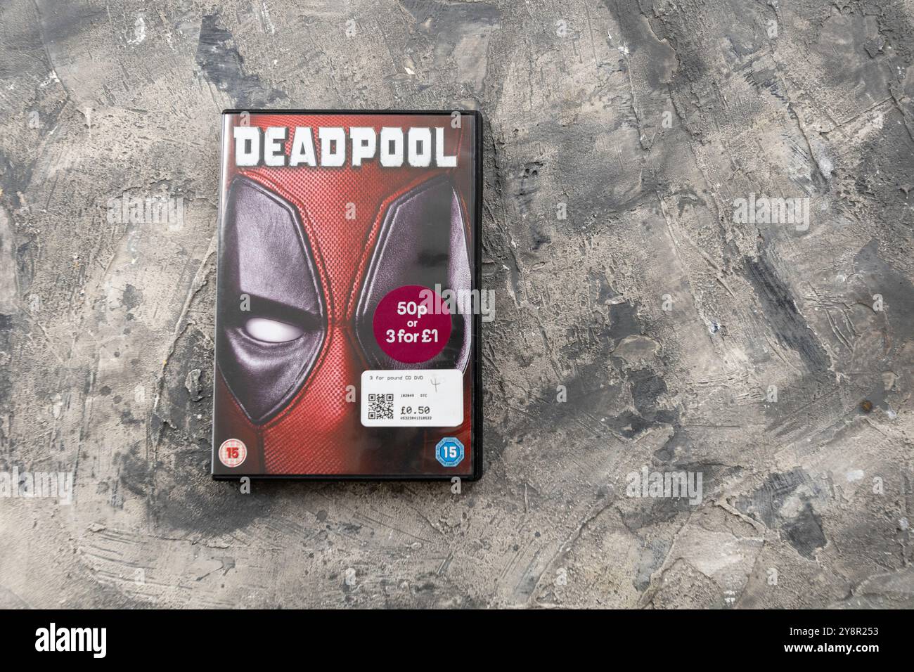 American superhero film Deadpool on DVD showing the red and black ...