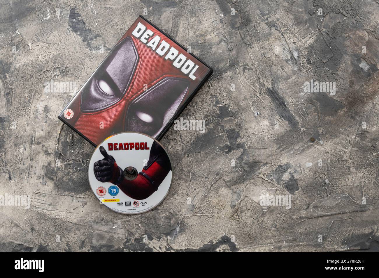 American superhero film Deadpool on DVD showing the red and black ...