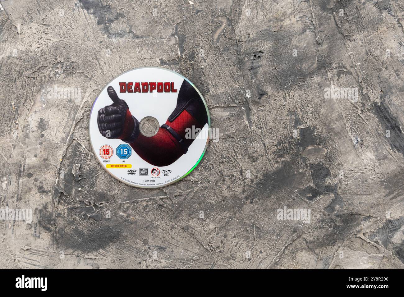 American superhero film Deadpool on DVD showing the red and black ...