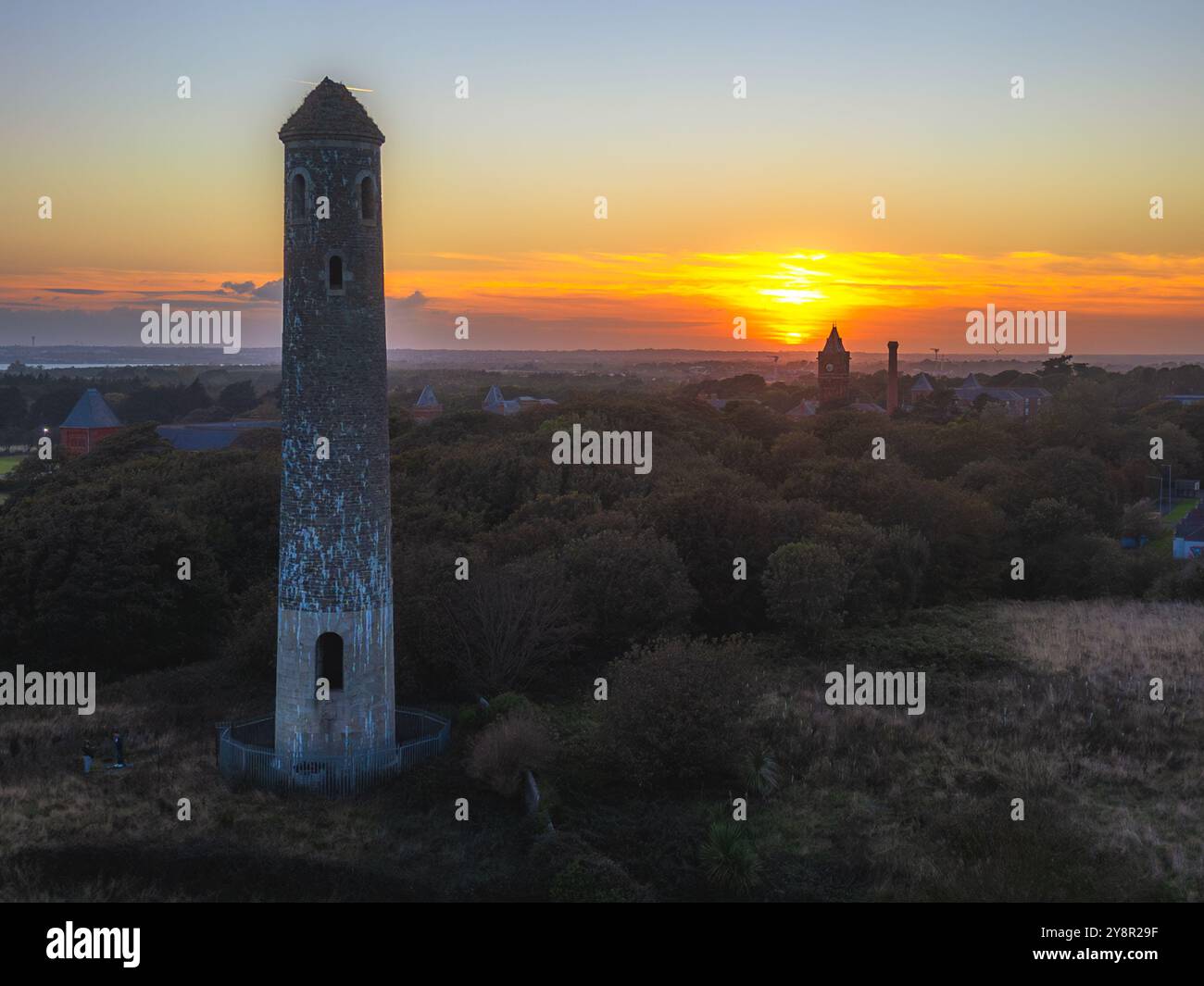 Sunset over St. Ita's and Portrane Round Tower Stock Photo - Alamy