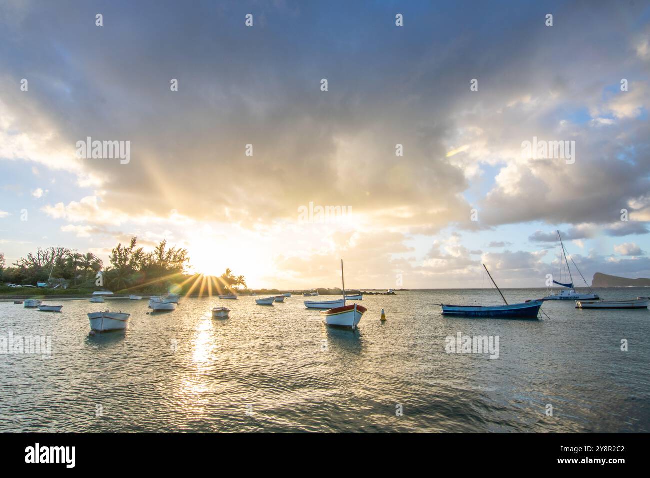 Landscape with a view over a small harbor with fishing boats. Tropical ...