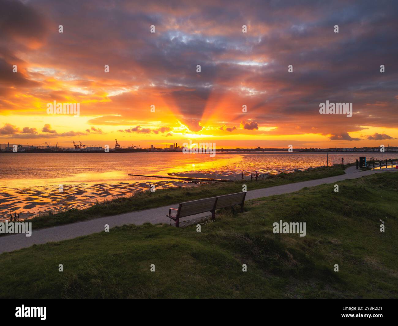 Bright crepuscular rays at sunset over the North Bull Wall Stock Photo ...