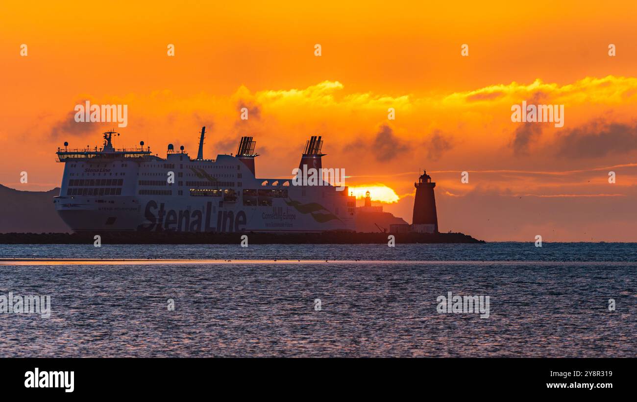 Stena Line passing by the sunrise lined up with the Baily Lighthouse ...