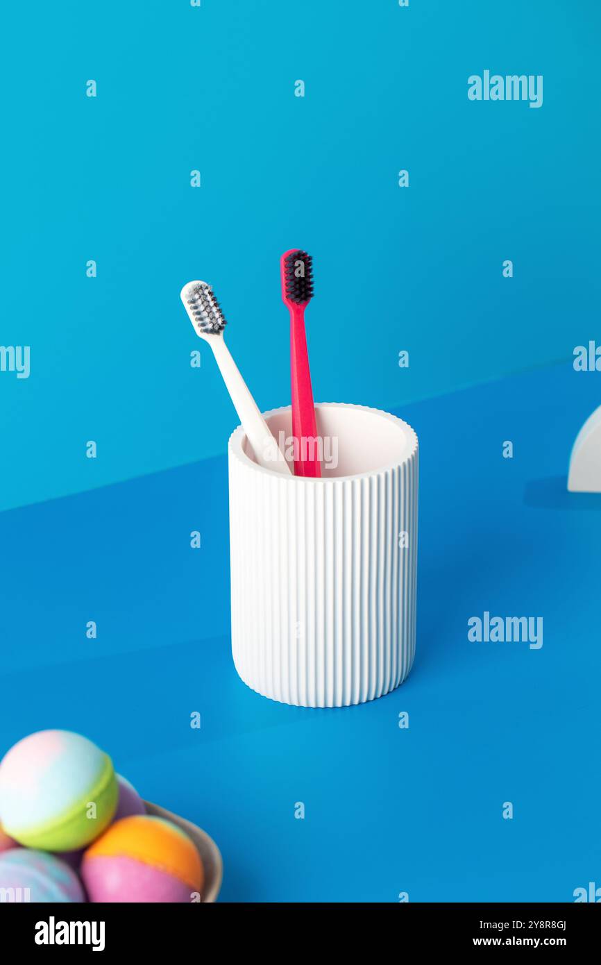 Tools for cleaning teeth stand in modern holder on counter Stock Photo ...