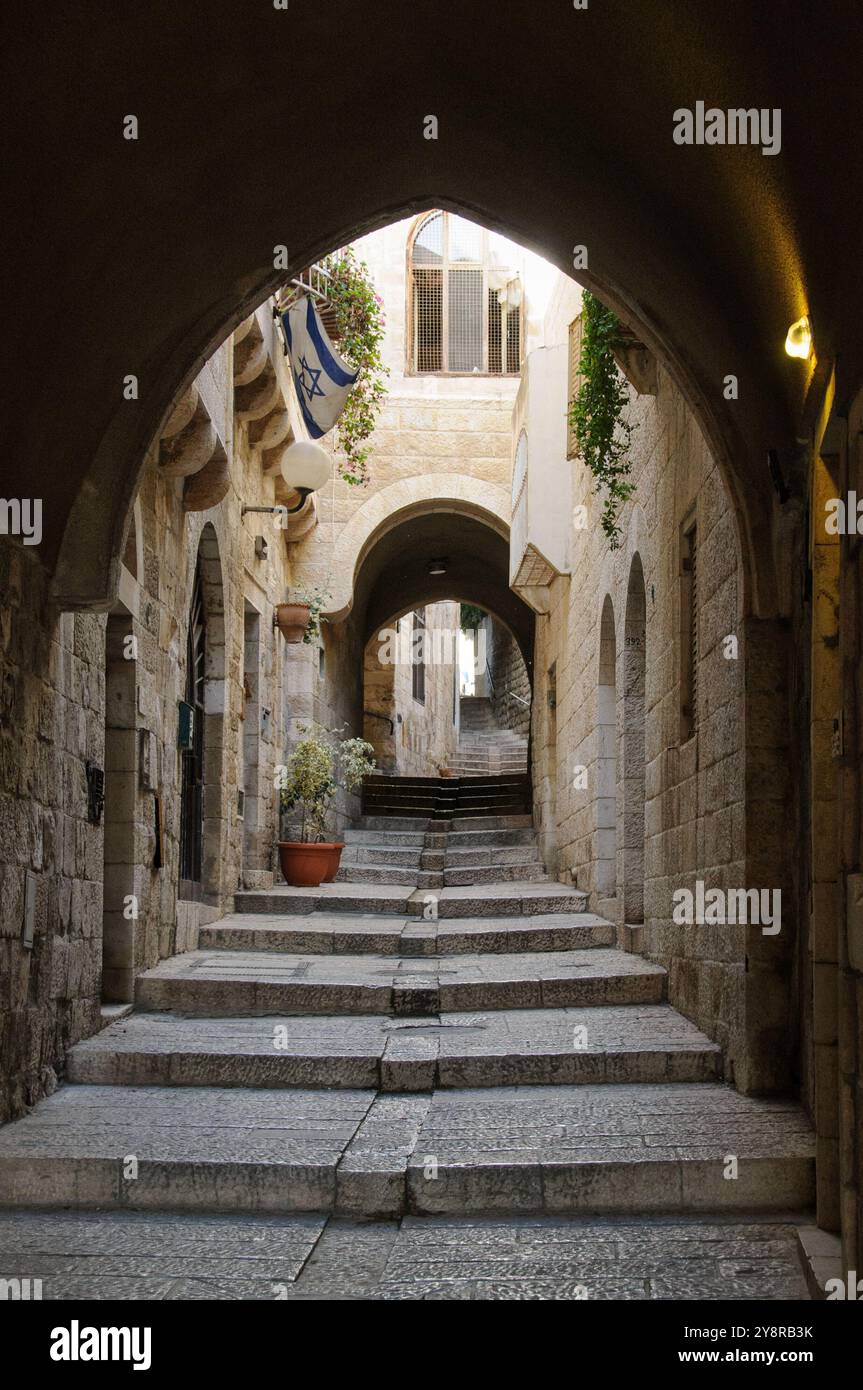 Arched tunnel and cobblestone staircase through the Jewish Quarter of ...