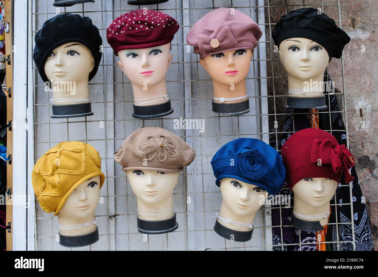 Colorful hats and hair coverings for women displayed on styrofoam ...