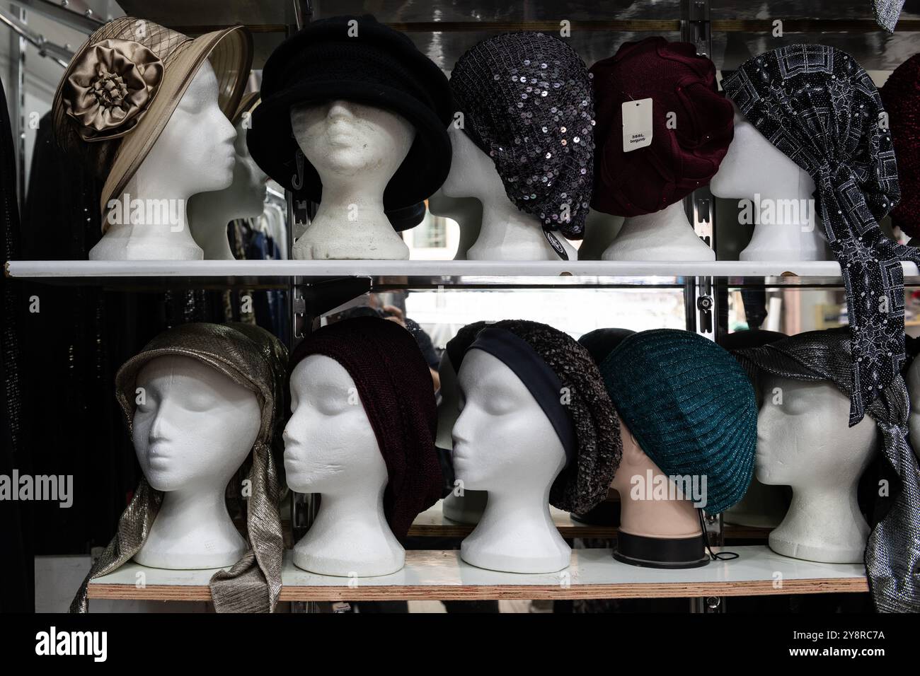 Colorful hats and hair coverings for women displayed on styrofoam ...