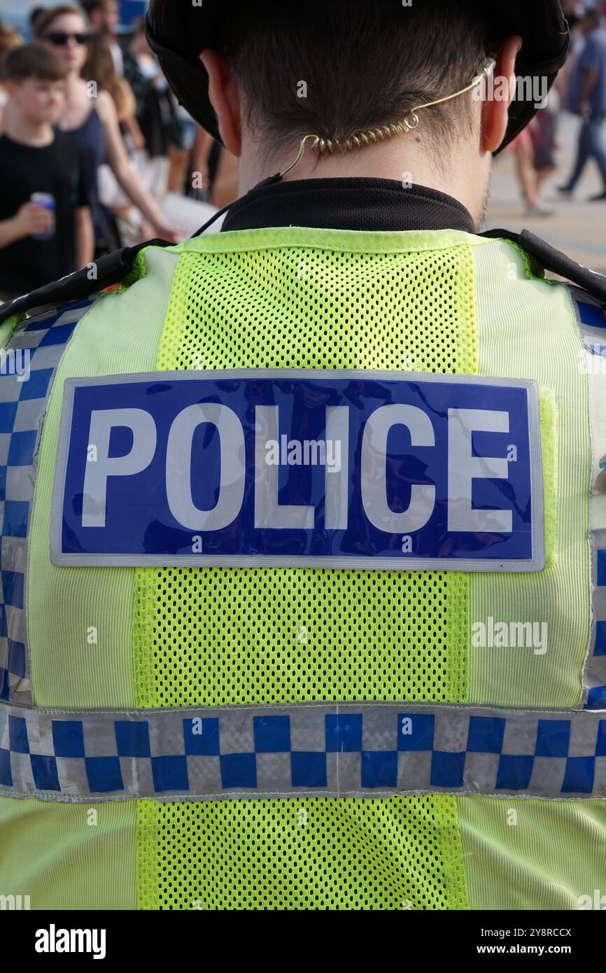 Police officer wearing reflective uniform. Law enforcement in the UK ...