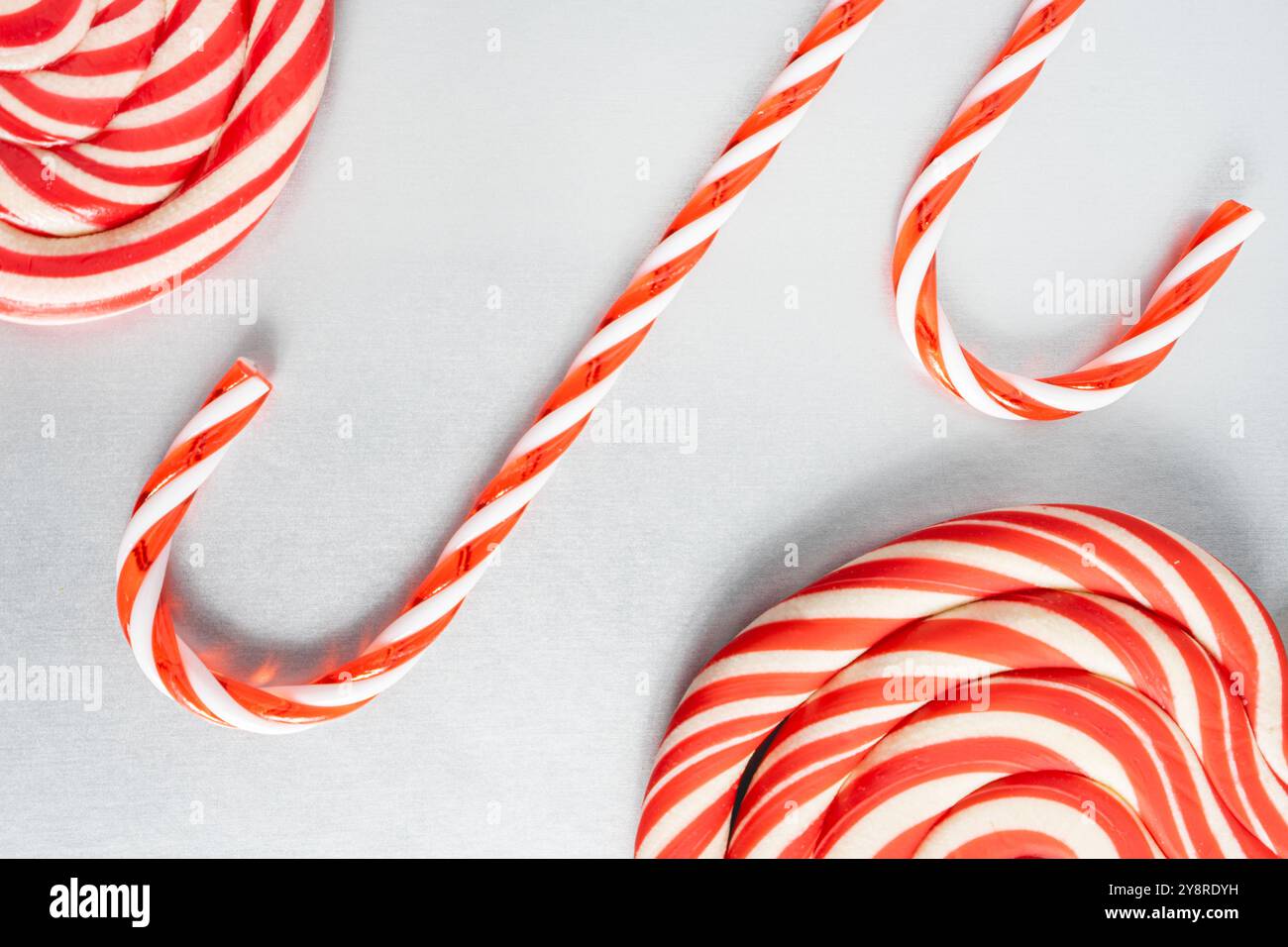 Christmas candy cane, and lollipop swirls. On a grey background Stock ...