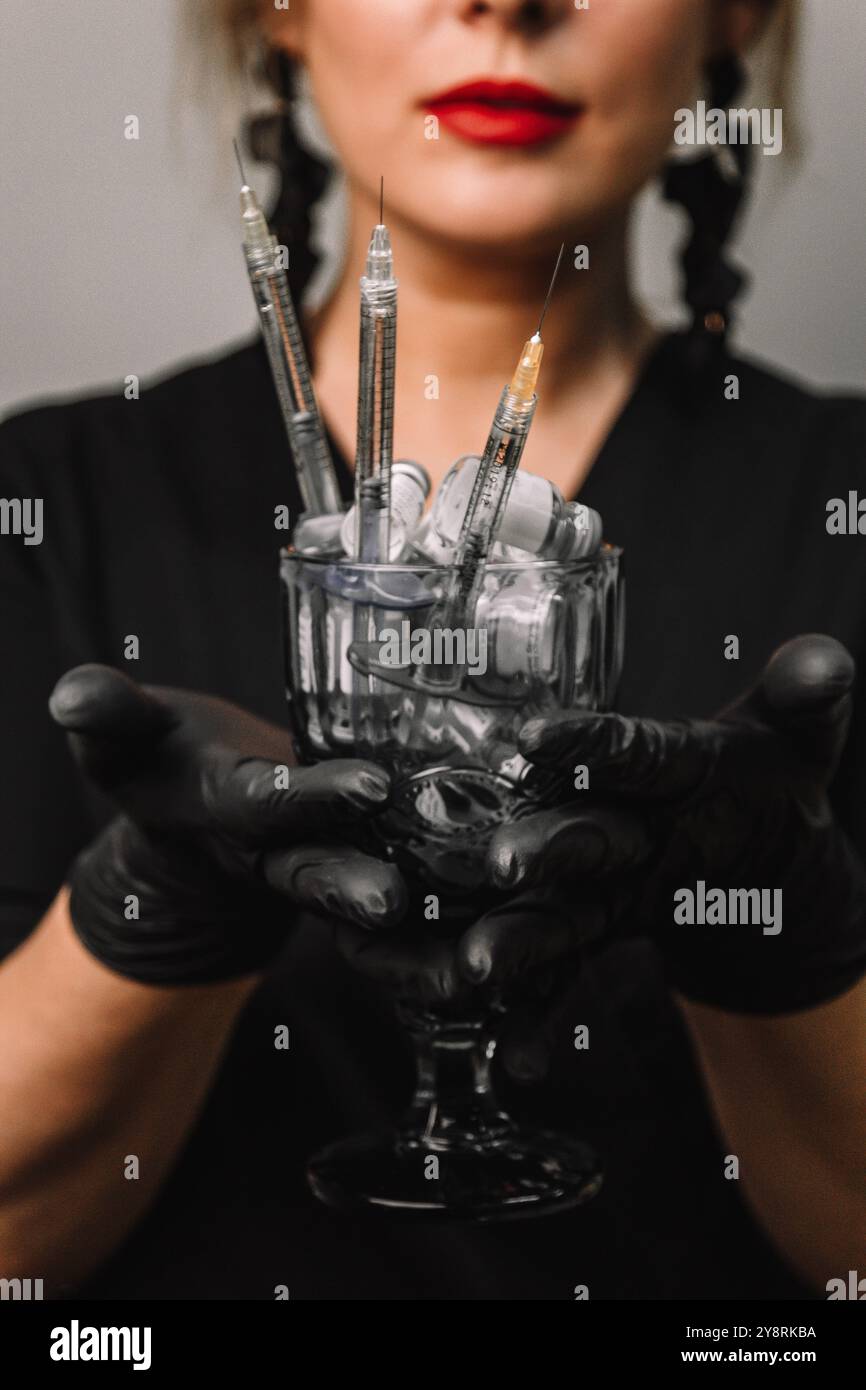 contour plastic. A cosmetologist injects a botulinum toxin to tighten ...