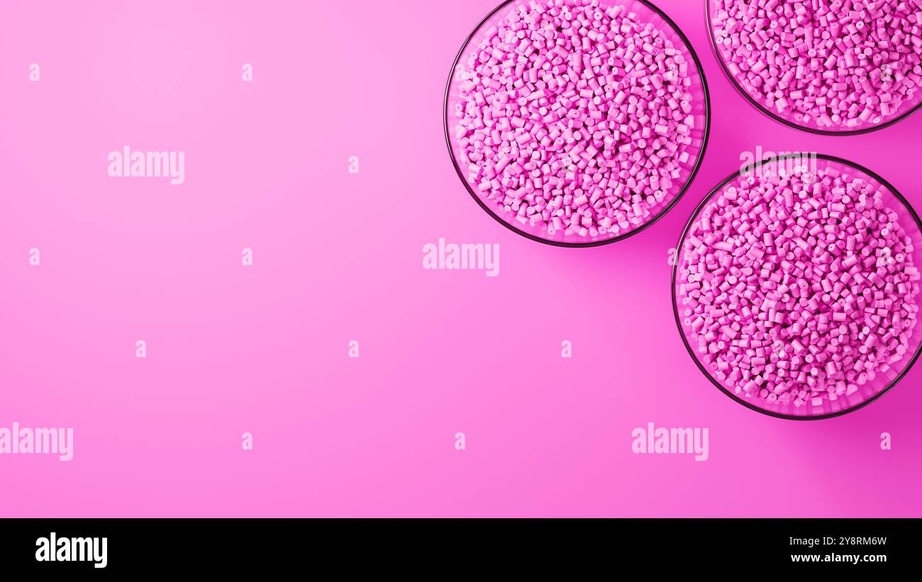 Top view on three glass cups with pink plastic polypropylene granules ...