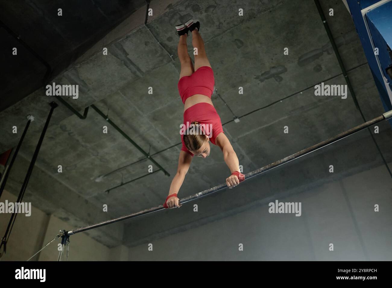 Low angle shot of professional female athlete in handstand on ...