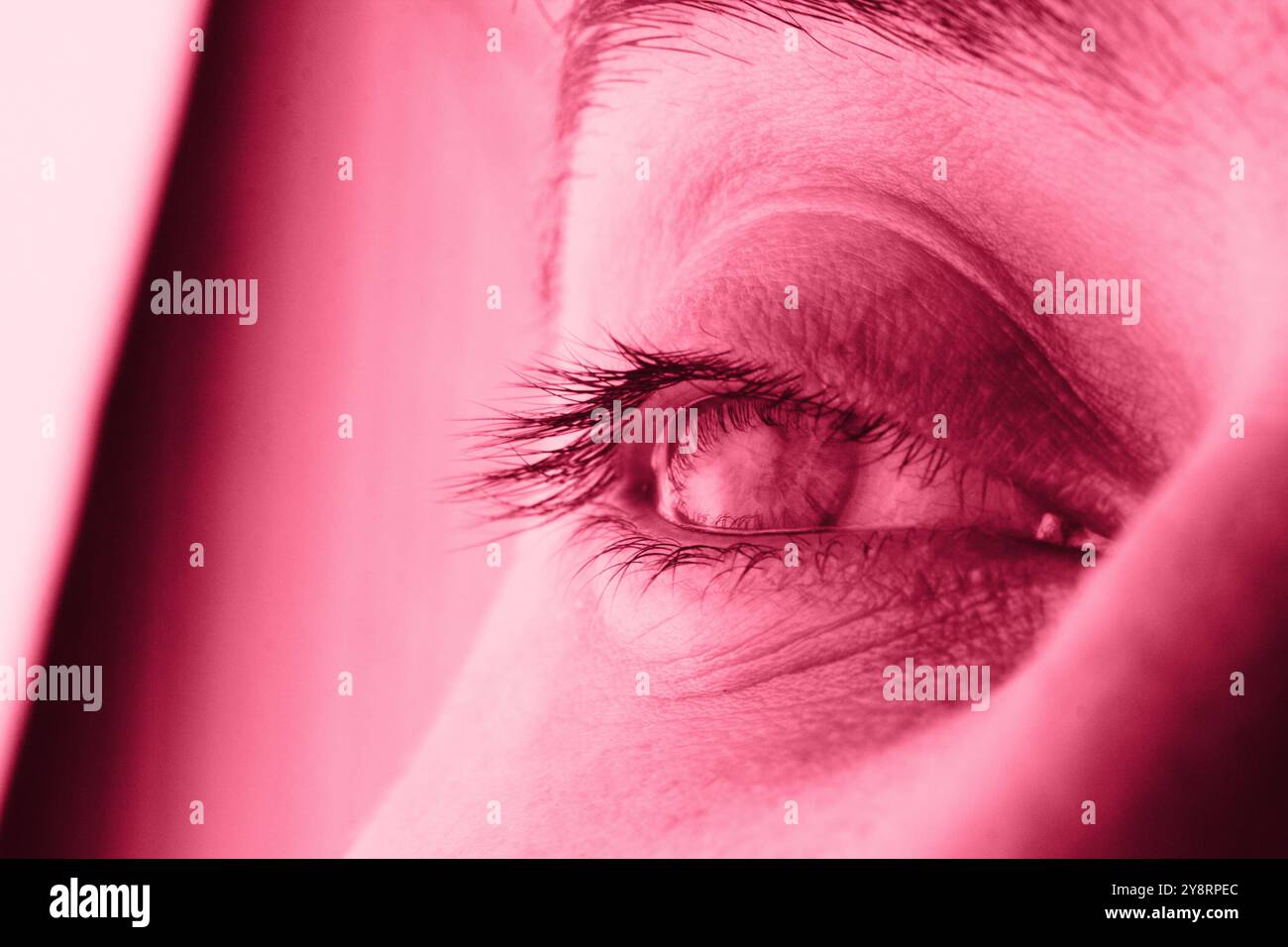 open human eye with bright red arteries close up. irritation and ...