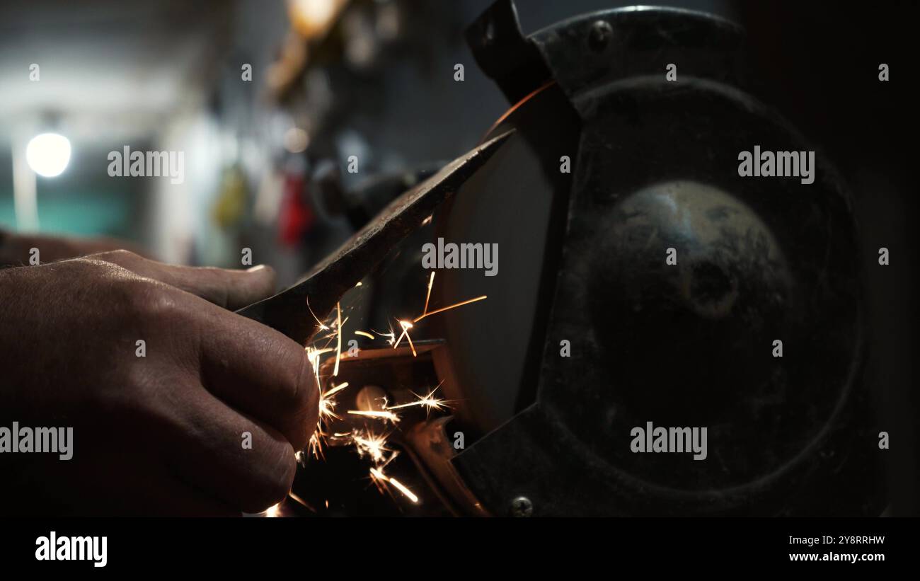 Sharpening shovel on grinding machine hi-res stock photography and ...