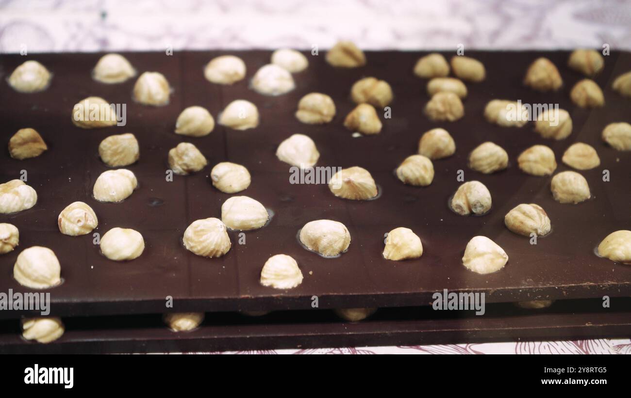 Delicious chocolate bars with nuts prepared from dark and milk ...
