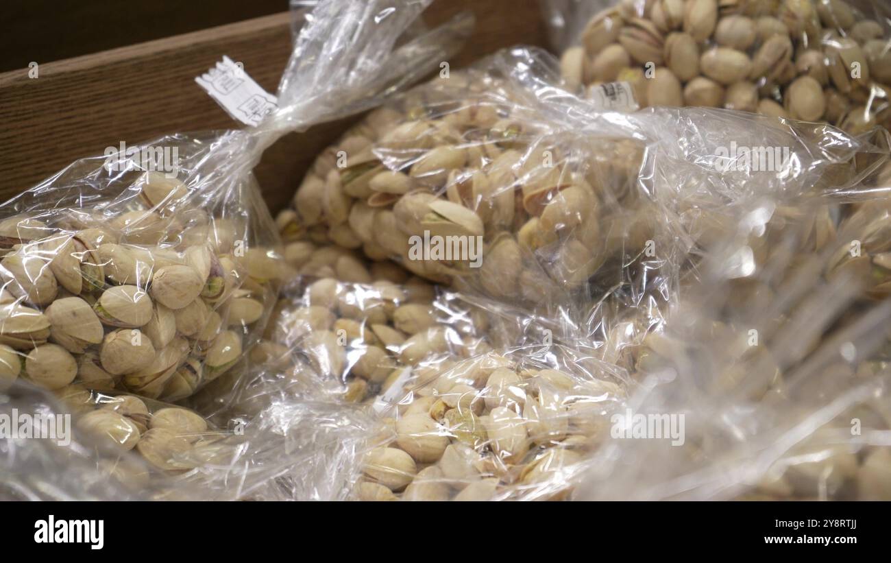 Arachis inside packaged plastic in a grocery store. Packaging from ...