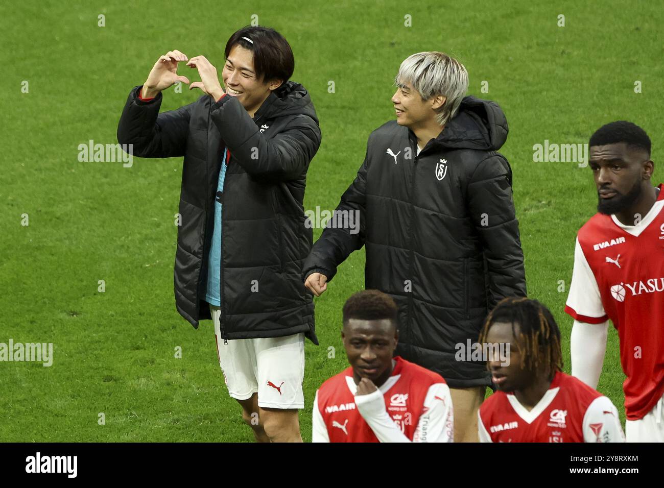 Keito Nakamura and Junya Ito of Reims celebrate the victory following the French championship ...