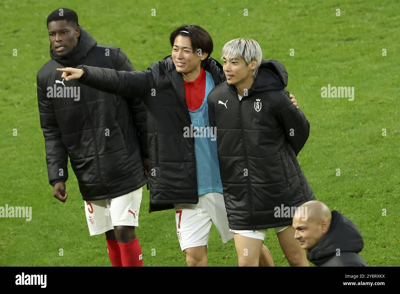 Keito Nakamura and Junya Ito of Reims celebrate the victory following the French championship ...