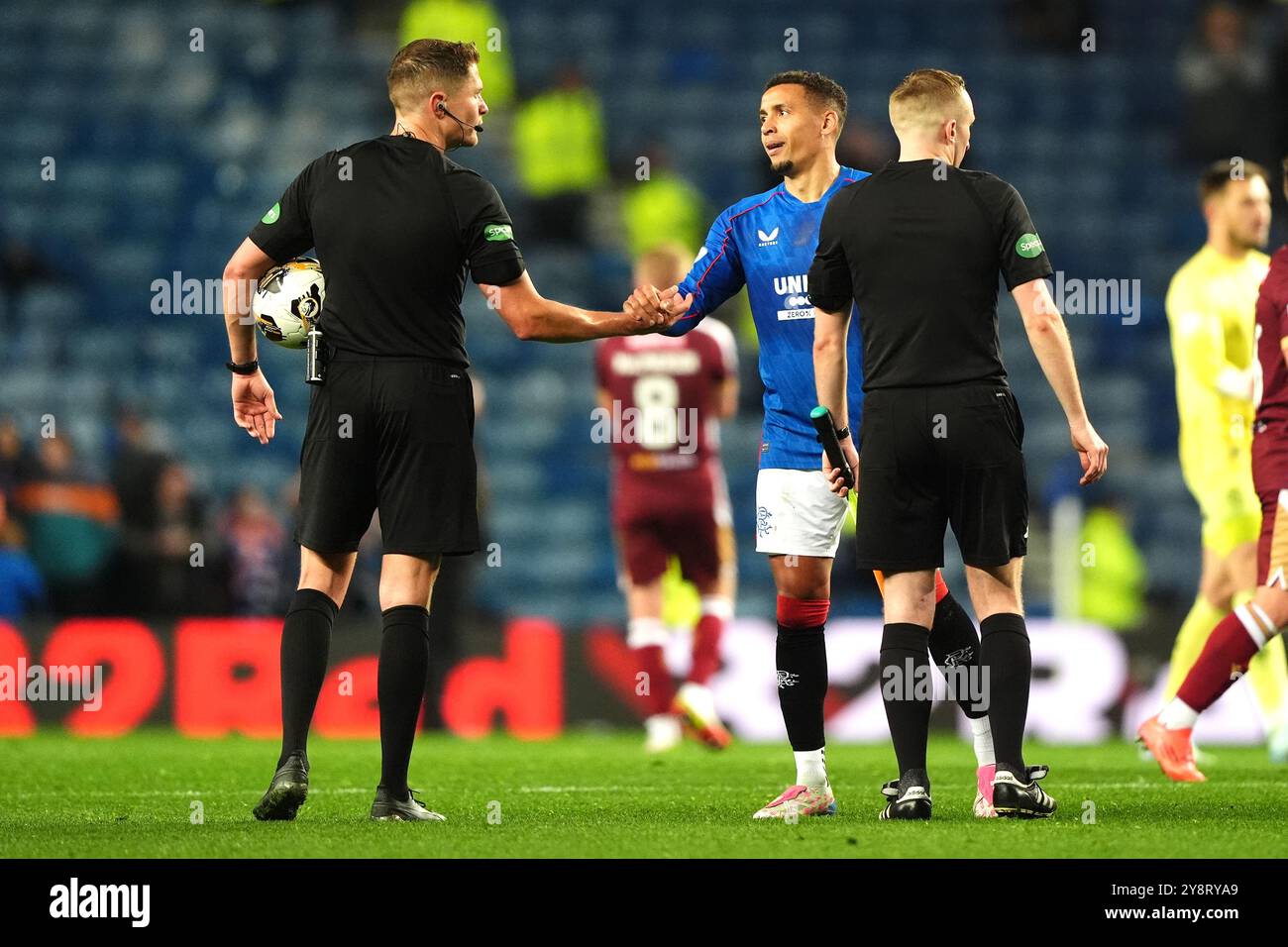 Rangers' James Tavernier shake hands with referee David Dickinson (left ...
