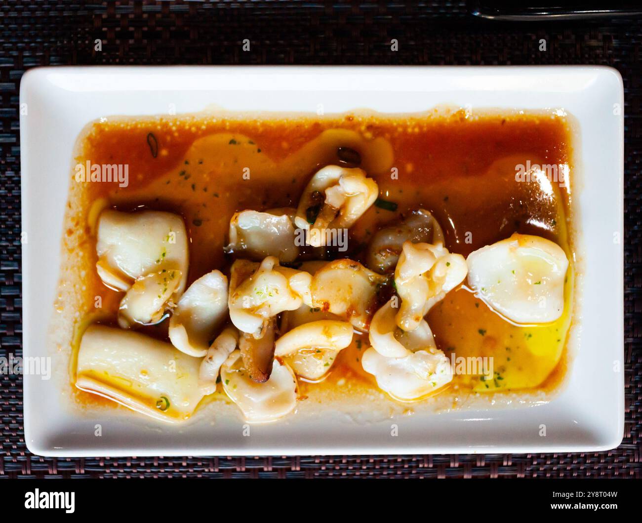 Fried cuttlefish in spicy sauce. Japanese food Stock Photo - Alamy