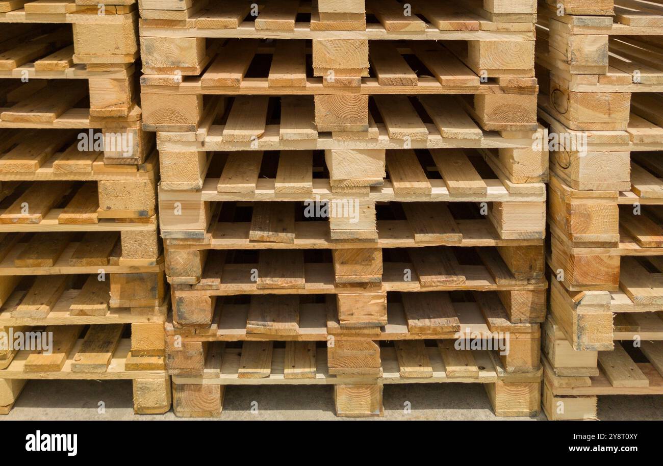 Stacked european stringer pallets. Wooden flat structure which supports ...