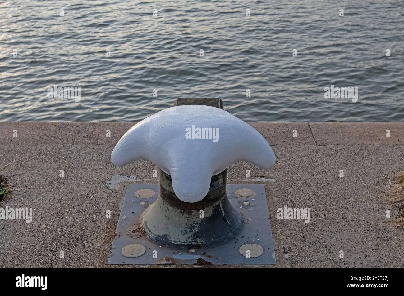 Mooring mast at the blue sea dock. Large bollard for mooring ships to ...
