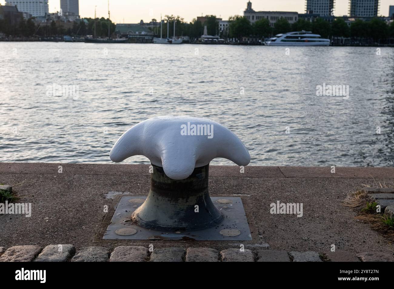 Mooring mast at the blue sea dock. Large bollard for mooring ships to ...