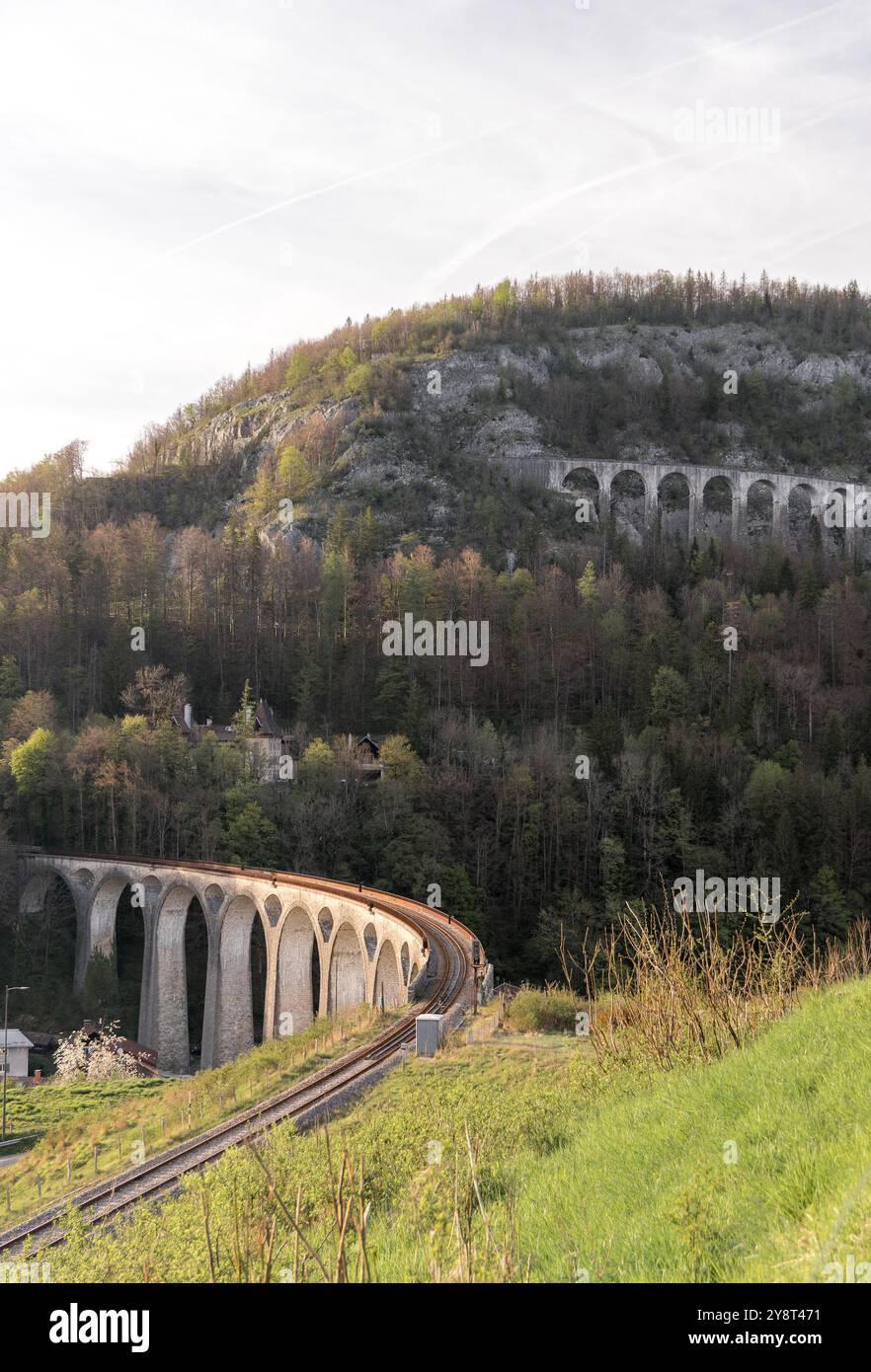 Two railway bridges in the forest of the French Jura during the golden ...