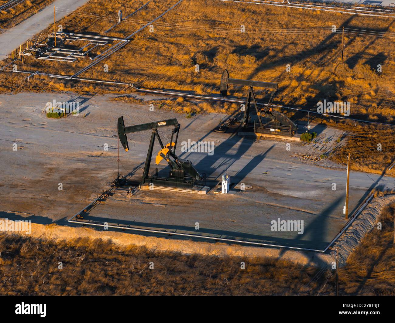 Aerial View of Oil Rigs and Pumpjacks in California Desert Stock Photo ...