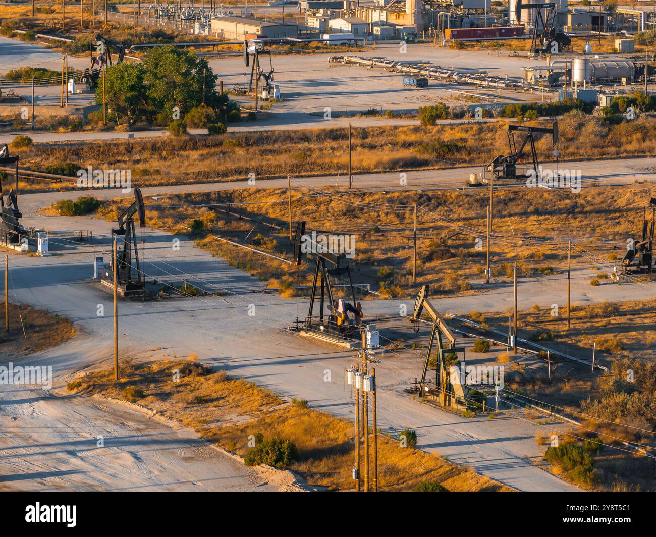 Oil Rigs in California Desert with Dirt Roads and Sparse Vegetation ...