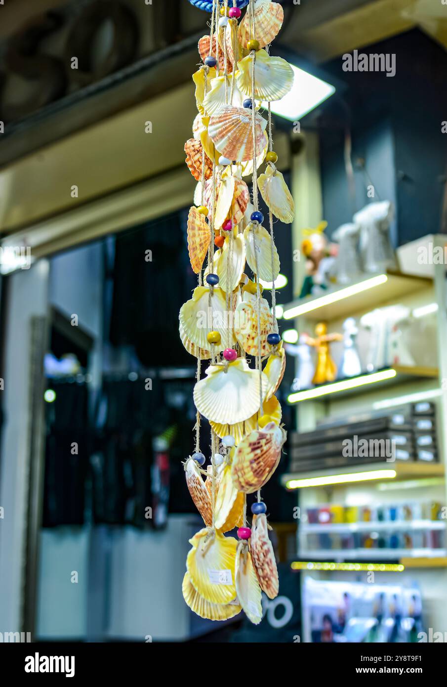 Evil eye beads, multi-colored seashells and souvenirs Stock Photo - Alamy