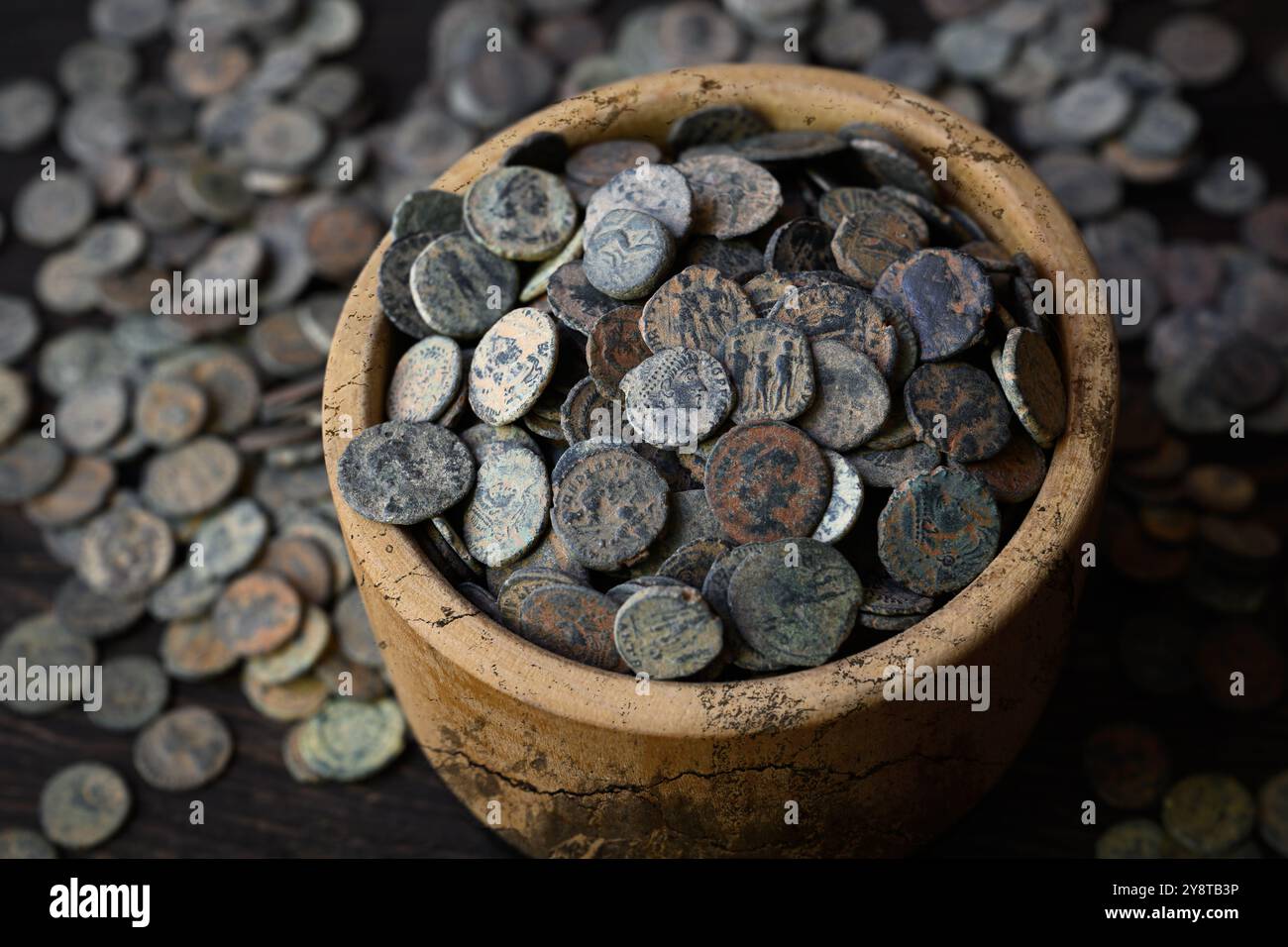 Ancient Roman coin hoard, lot of old money in wooden pot and pile on ...