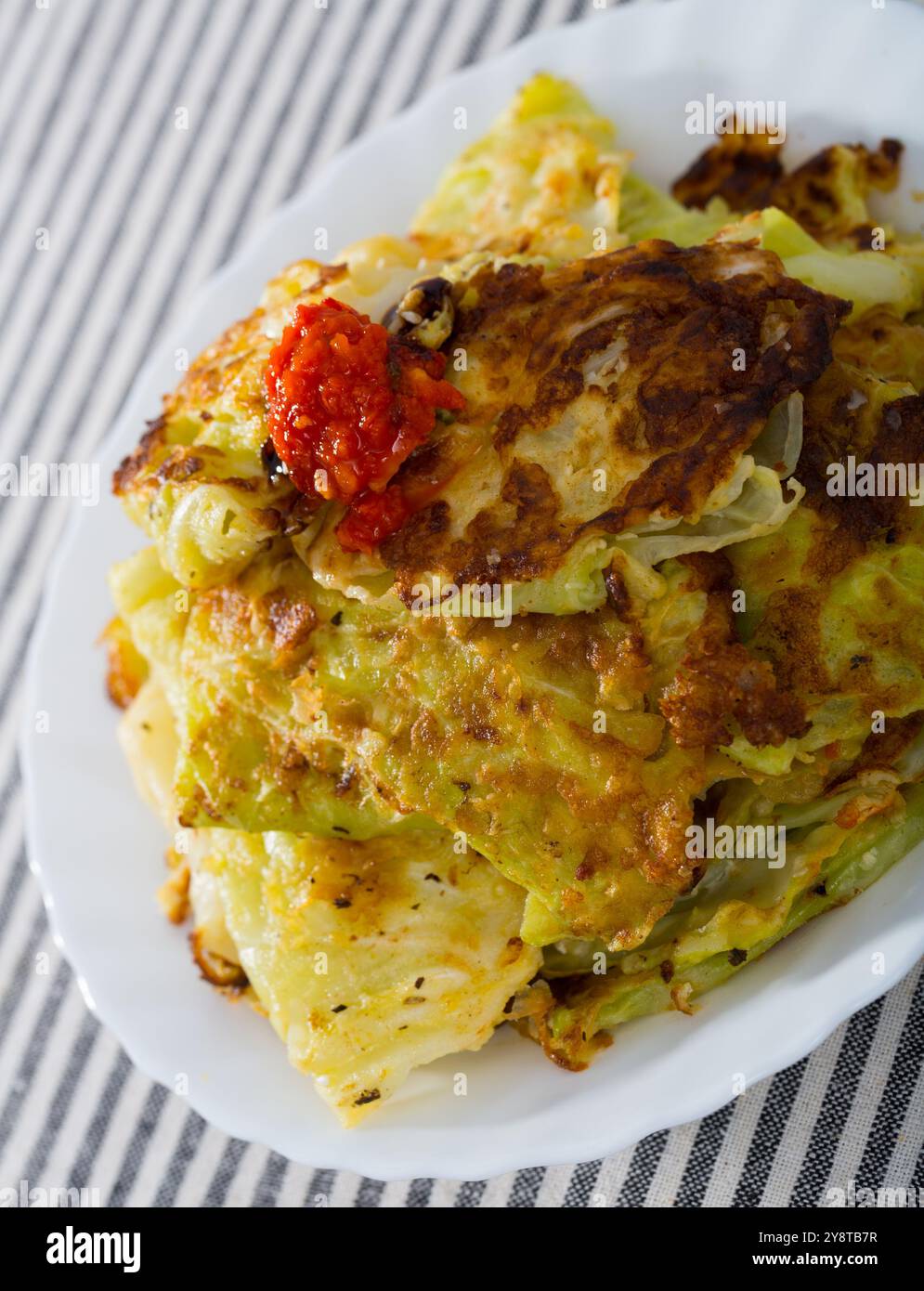 Photography of plate with cabbage leaves in batter Stock Photo - Alamy