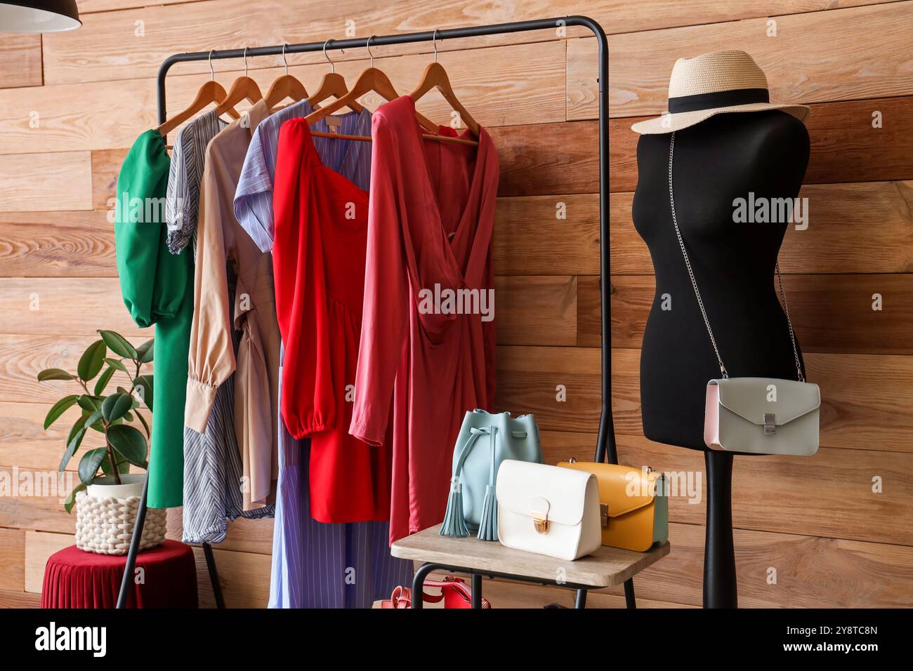 Interior of dressing room with mannequin, clothes rack and table Stock ...