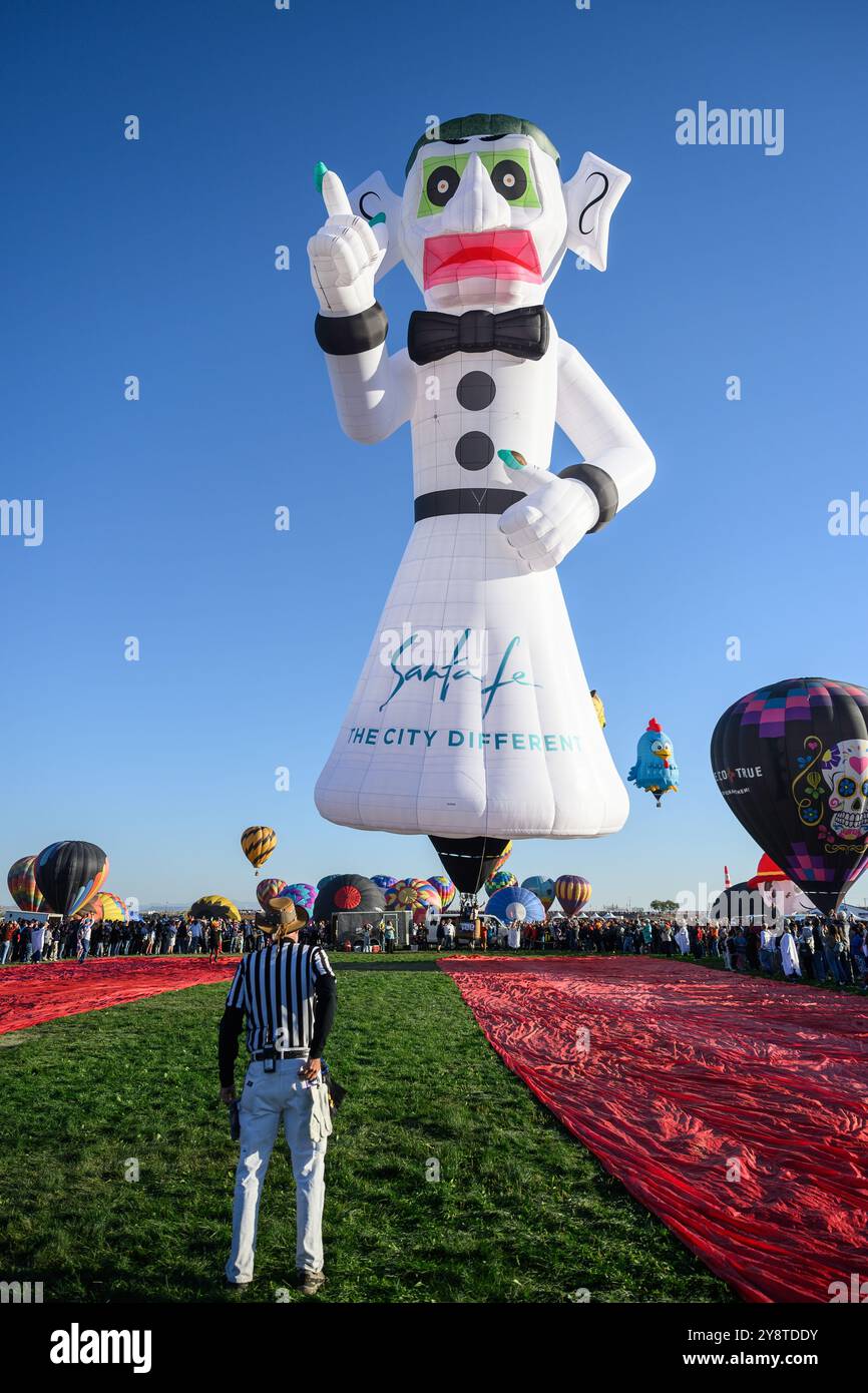 A flight director, front, gets ready to signal approval for the Zozobra ...