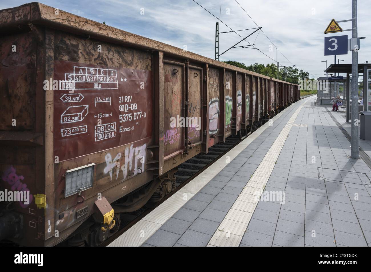 Goods train passes through the railway station in Hassfurt, Lower ...