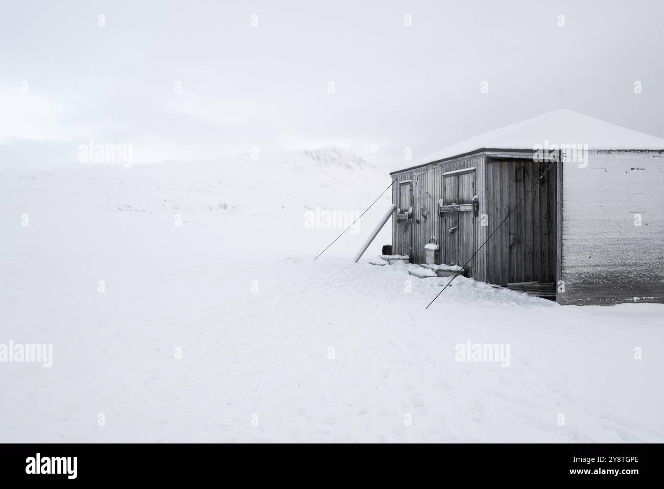 Fence, wooden house, Swedish-Finnish research station Kinnvika, wintry ...