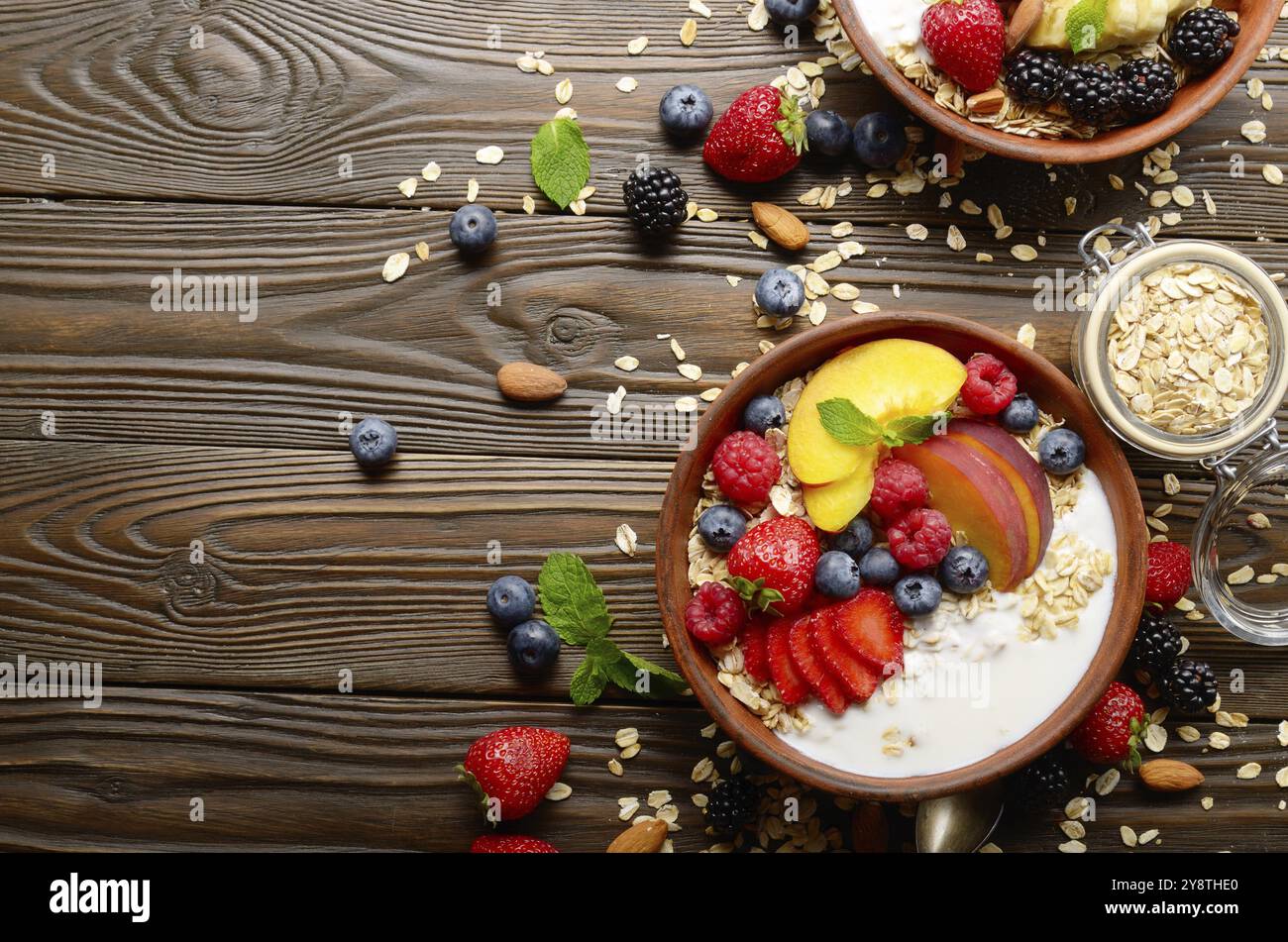 Flat lay of fruit healthy muesli with peaches strawberry almonds and ...