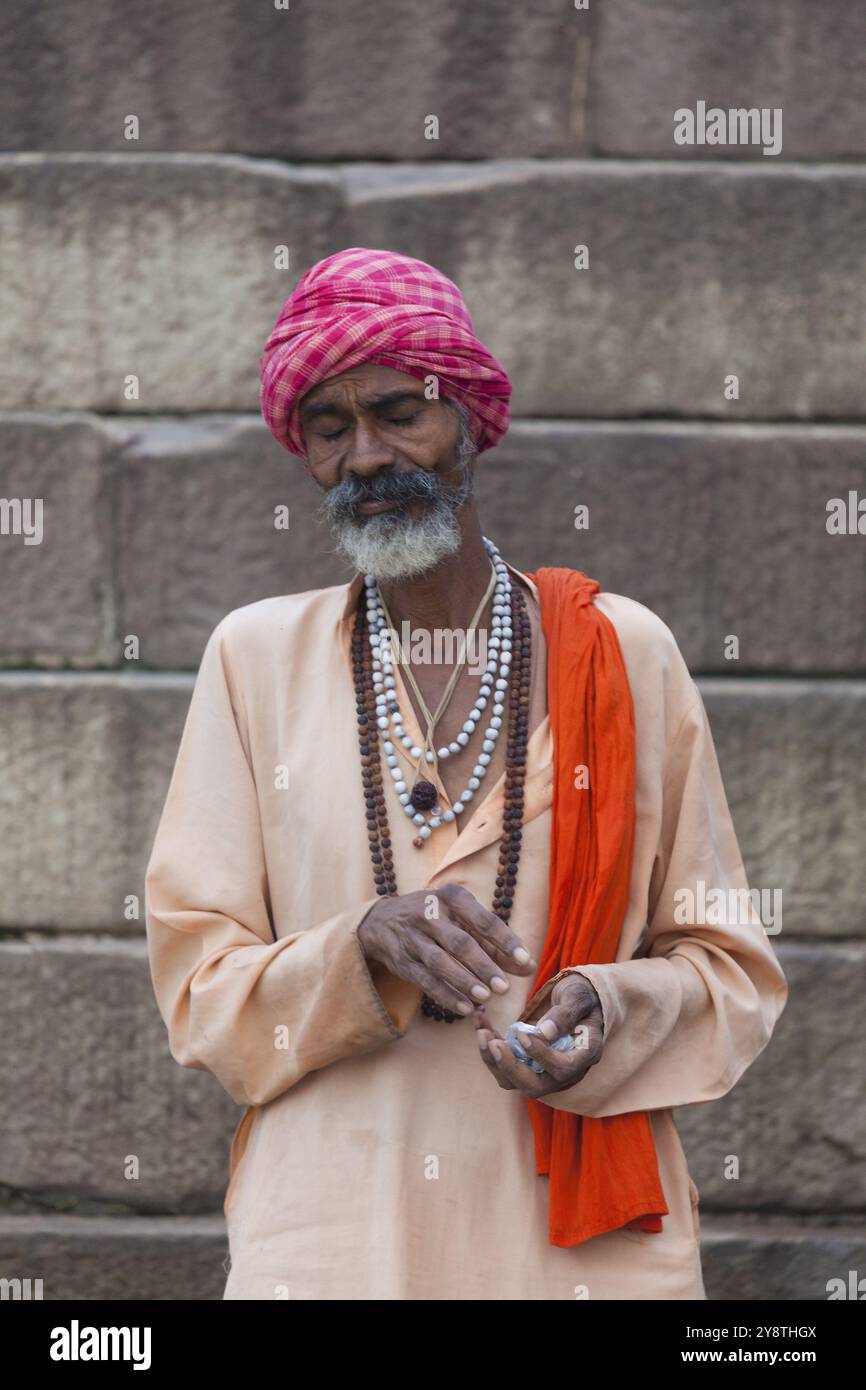 Pilgrim at ghat steps on river Ganges, Varanasi, Uttar Pradesh, India ...
