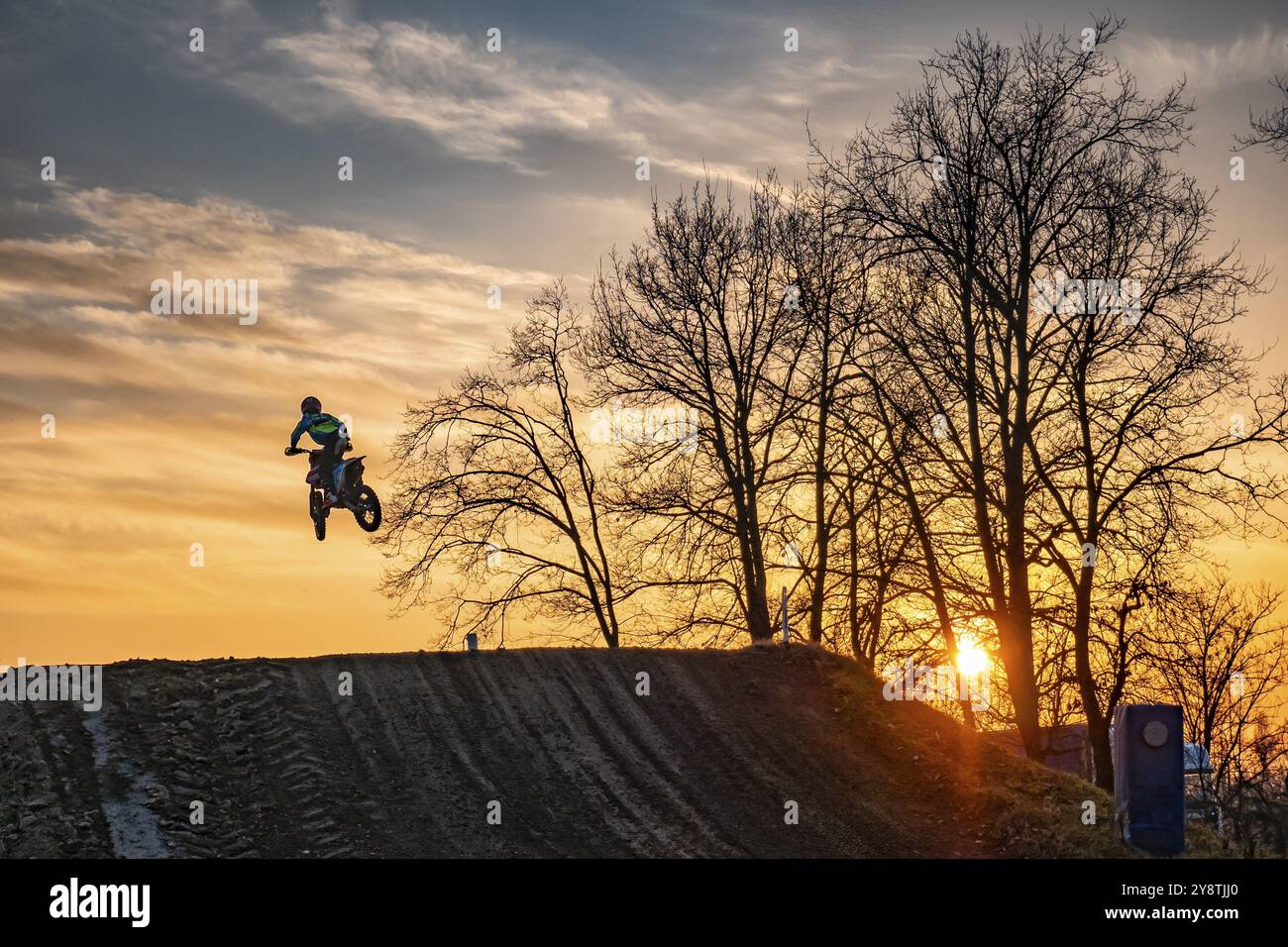 Motocross scene in sunset hours Stock Photo - Alamy