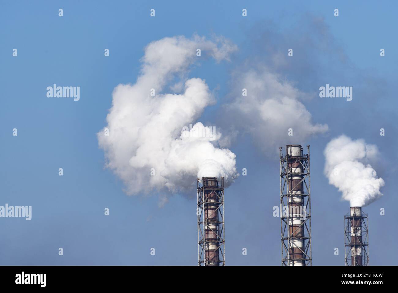Smoke stack of coal power plant on blue sky background Stock Photo - Alamy