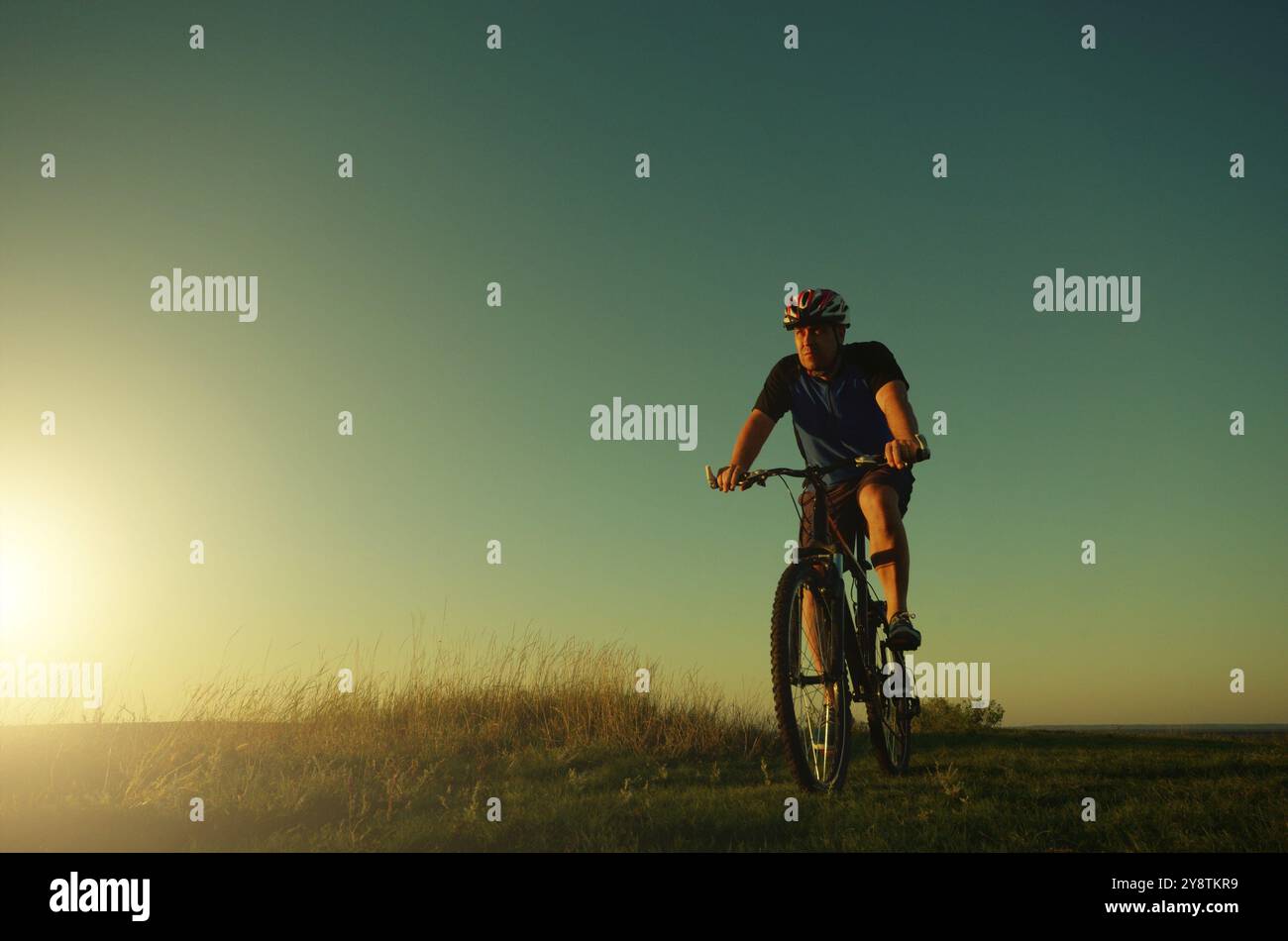 Bike in sunset light cyclist hi-res stock photography and images - Alamy