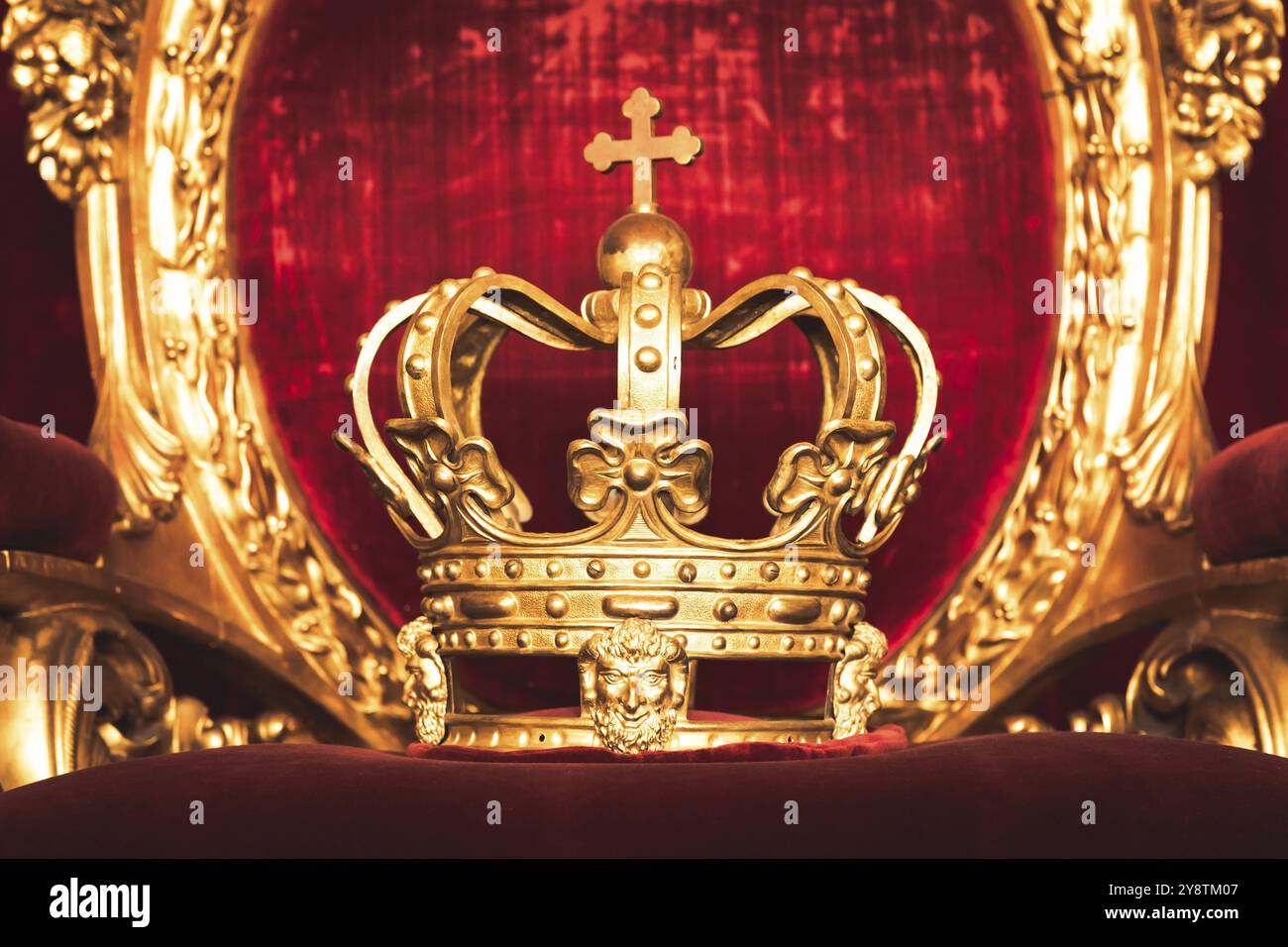 Ancient crown on red velvet. Antique symbol of authority, luxury ...