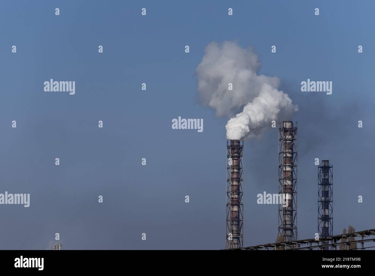 Smoke stack of coal power plant on blue sky background Stock Photo - Alamy