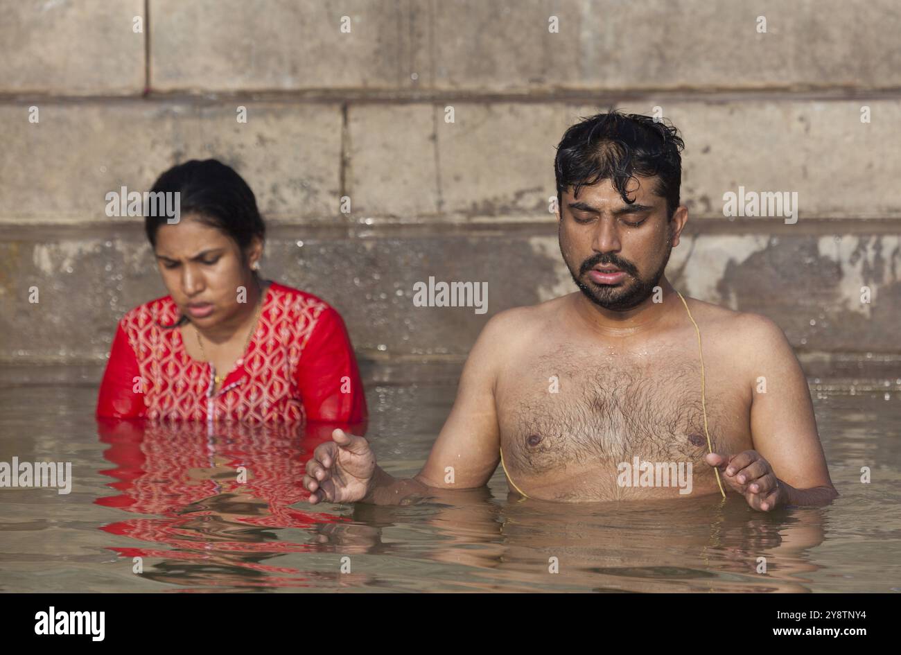Pilgrims at ghat steps on river Ganges, Varanasi, Uttar Pradesh, India ...