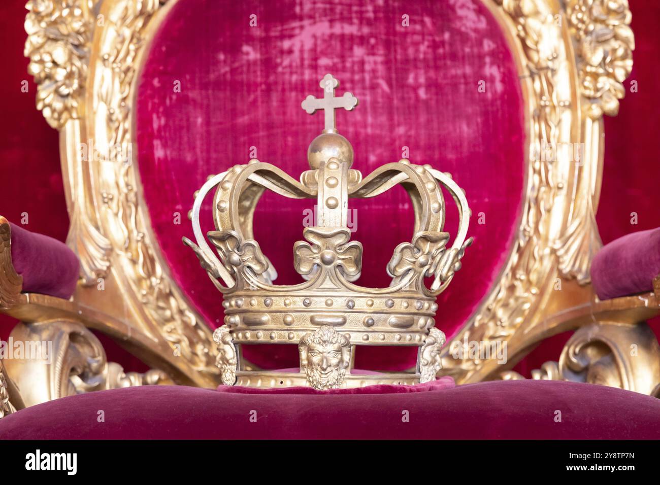 Ancient crown on red velvet. Antique symbol of authority, luxury ...