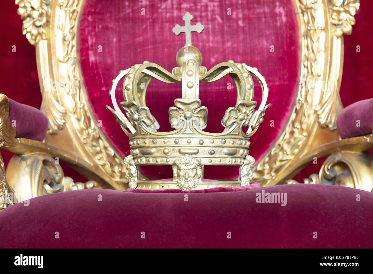Ancient crown on red velvet. Antique symbol of authority, luxury ...