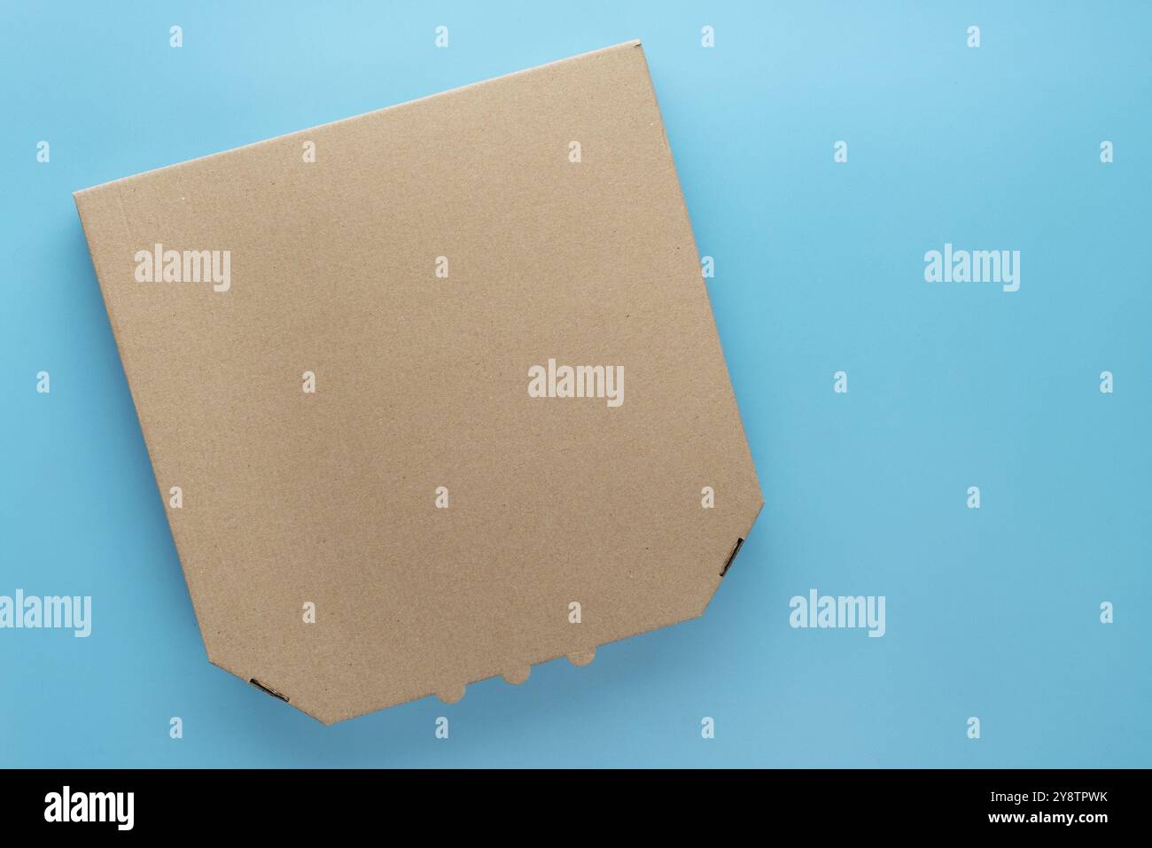 Pizza closed carton box on uniform blue background flat lay mockup with ...